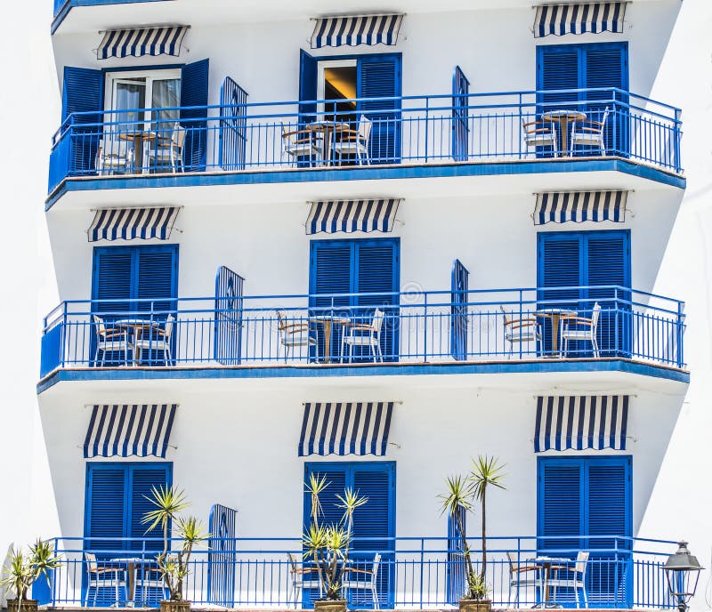 Residential White Building with Blue Windows Stock Image - Image of ...
