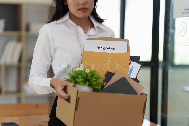 Resignation Concept. Fired Employee Holding Box of Belongings in an ...