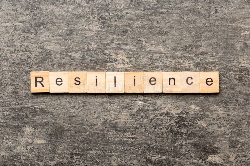 Resilience Word Written on Wood Block. Resilience Text on Table ...