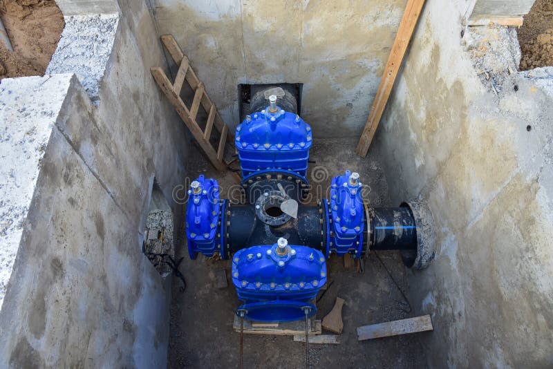 Gate Valves in Valve Pit of the Underground Piping Networks. Laying ...