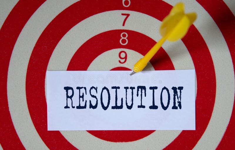 RESOLUTION - Word on a White Piece of Paper on the Background of a ...
