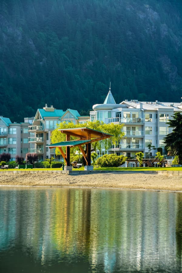 Resort Buildings at Waterfront on Mounting Forest Background Stock ...