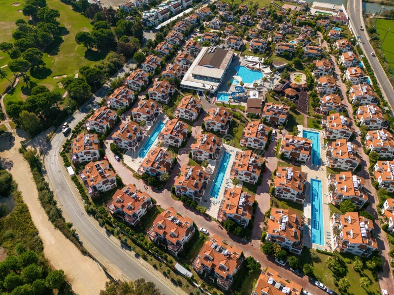 Resort Consisting of Villas with Pools Built Next To the Golf Course ...