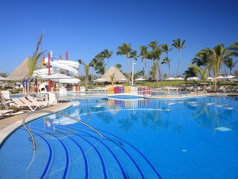 Resort with palms and pool stock photo. Image of water - 12650940