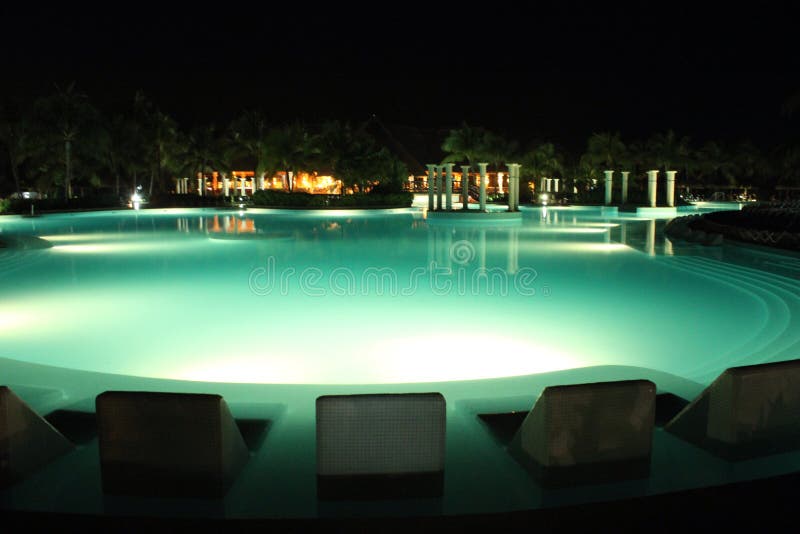 Resort pool at night stock image. Image of grand, pool - 65664199