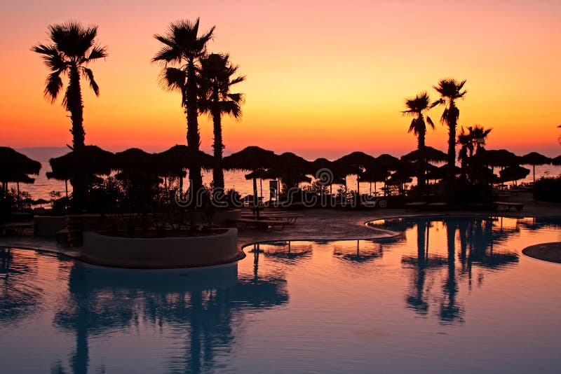 Resort pool at sunset stock image. Image of poolside - 21508907