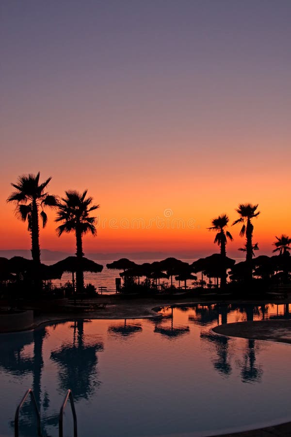 Resort pool at sunset stock image. Image of night, dreams - 21654087