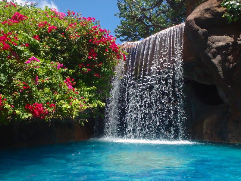 Resort pool and waterfall stock image. Image of colorful - 86133917