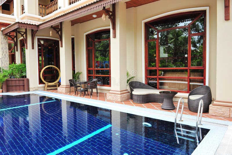 Resort Swimming Pool and Dining Area Stock Image - Image of area, chair ...