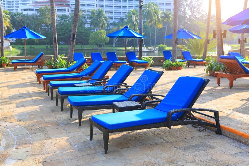 Resort Swimming Pool with Empty a Lounge Chairs in the Morning Stock ...