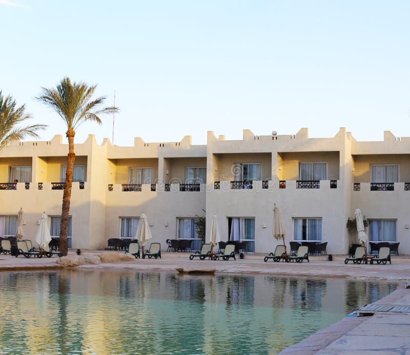 Resort Swimming Pool for Relaxation with Sunbeds Stock Photo - Image of ...