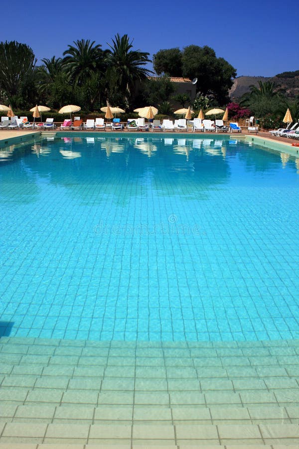 Resort swimming pool scene stock photo. Image of resort - 3234768