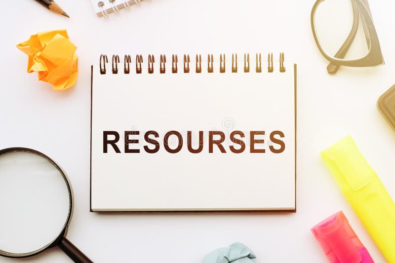 The Resources Text is Written on a White Notepad Next To Magnifier and ...