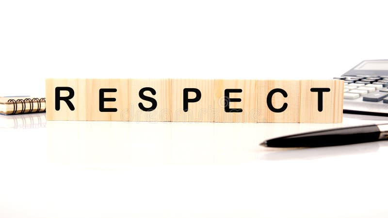 Respect Word Assembled from Wooden Cubes Next To a Calculator, Pen and ...