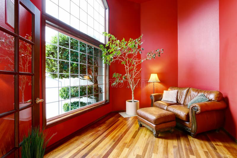 Rest Area with Red Walls, Big Window and Leather Sofa Stock Image ...