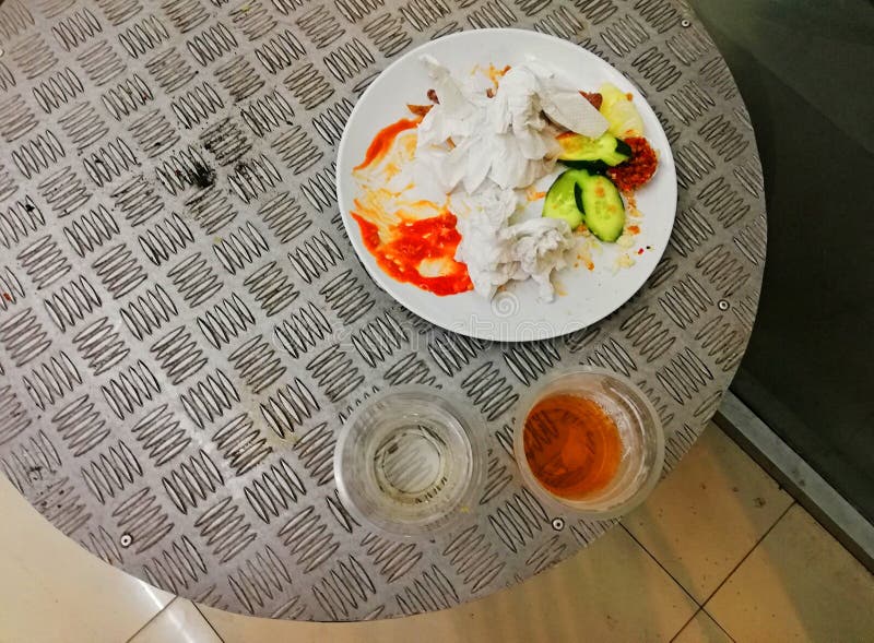 The Rest of Food Left on White Plate,on Metal Table Stock Photo - Image ...