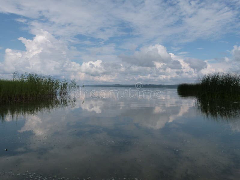 Rest on the Lake River Reeds Stock Image - Image of smooth, clouds ...
