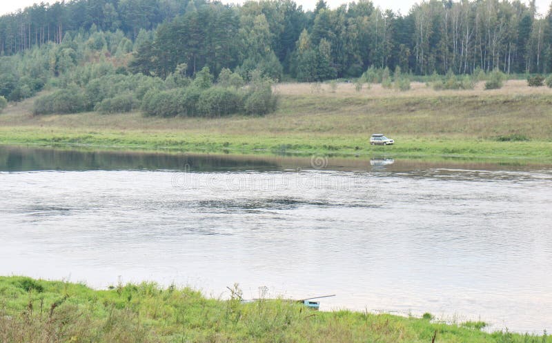 Rest on the river bank stock image. Image of grass, green - 101321963
