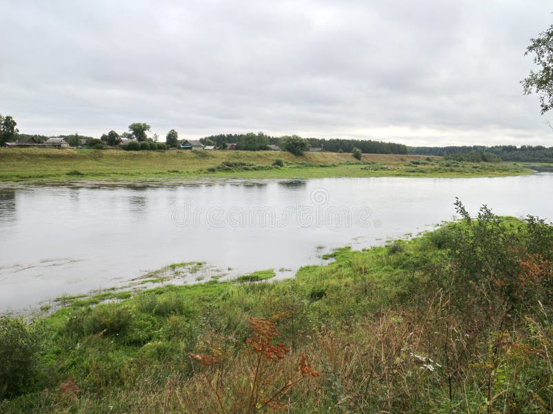 Rest on the river bank stock image. Image of cloud, green - 101325217