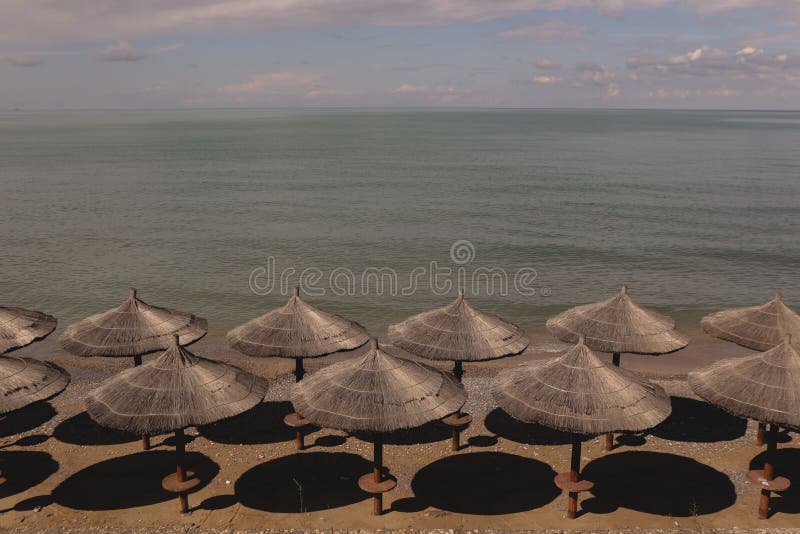 Rest by the Sea on the Beach with the Same Umbrellas. Stock Photo ...