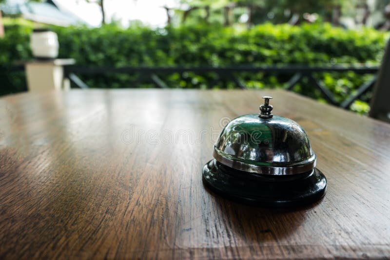 Restaurant bell on table stock photo. Image of counter - 94390536