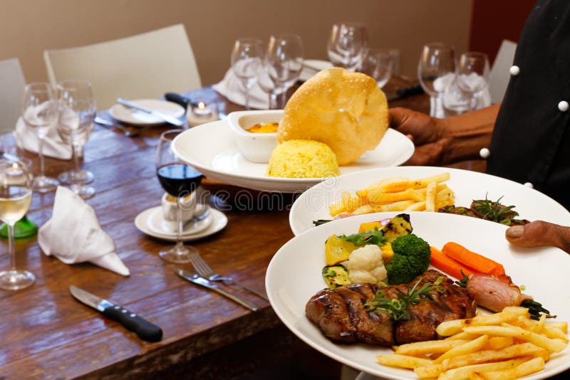 Restaurant Chef Serving Food at a Table Stock Image - Image of meal ...