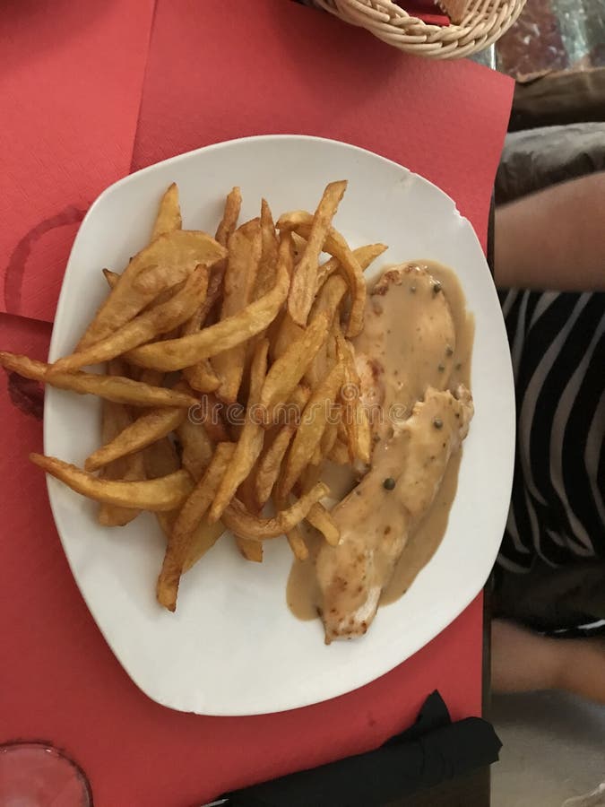 At the Restaurant, Chips and Meat Stock Image - Image of mallorca ...