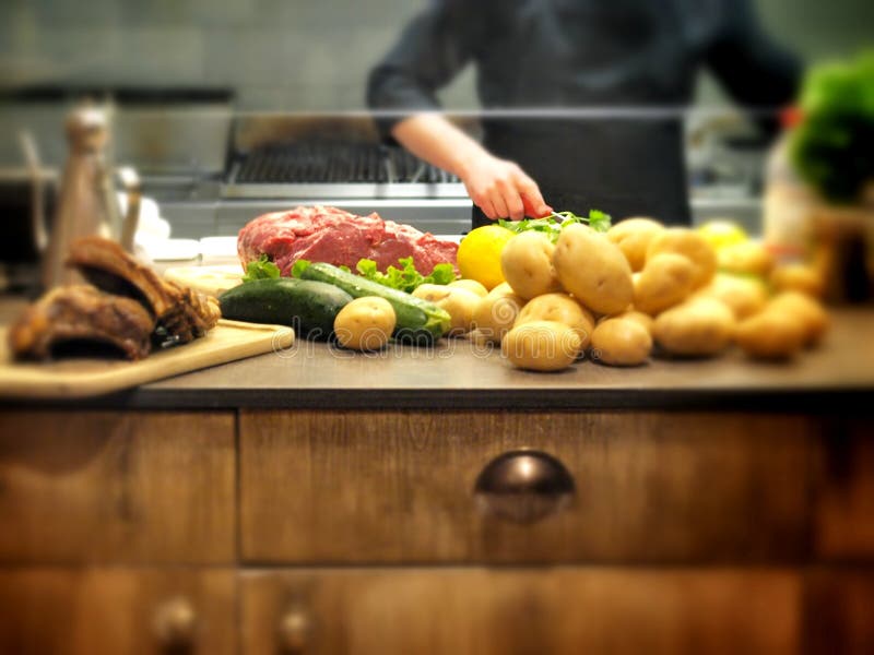 Restaurant Counter with Meat Potatoes and Zucchini before Cooking Stock ...