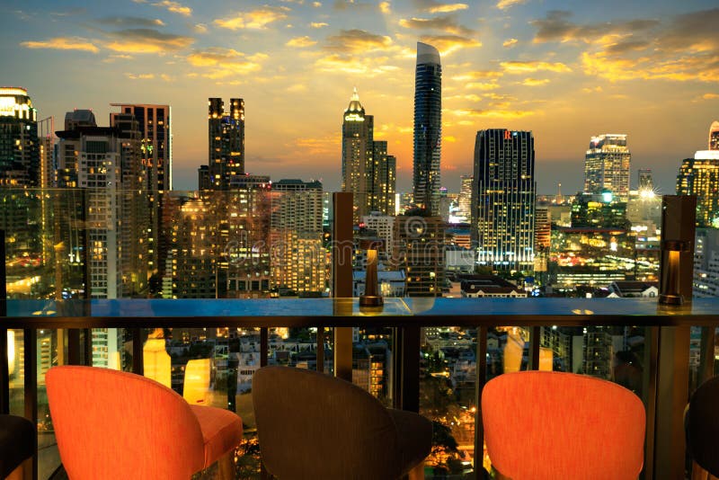 Restaurant Dining Table and View of Business Building on Terrace at ...