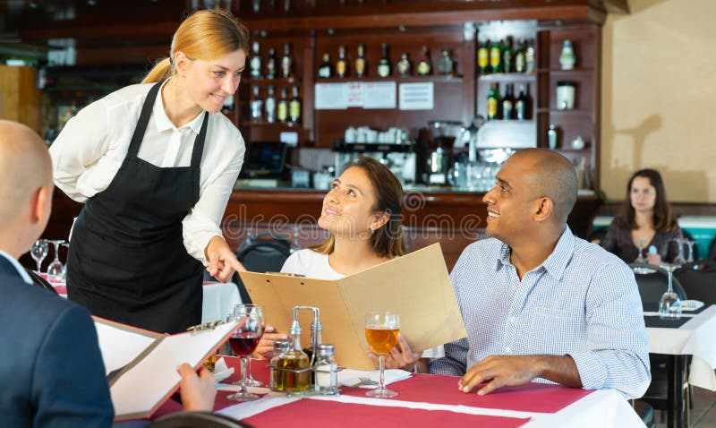 Polite Waitress Taking Order from Couple in Pizza Restaurant Stock ...