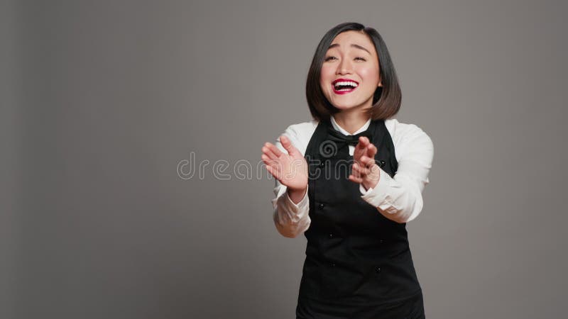 Restaurant Hostess Clapping Hands and Celebrating for Someone, Stock ...