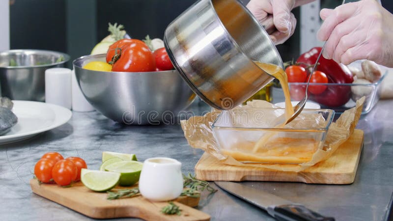Restaurant Kitchen. Chef Pouring Soup in the Glass Deep Plate Stock ...