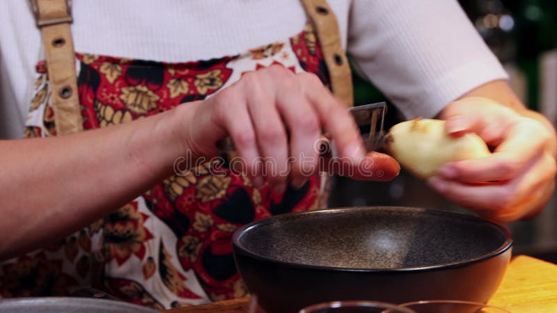 Restaurant Kitchen - Woman Chef Peeling Potatoes Stock Footage - Video ...