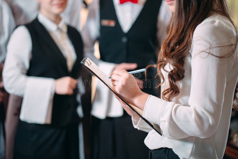 Restaurant Manager and His Staff in Kitchen. Interacting To Head Chef ...