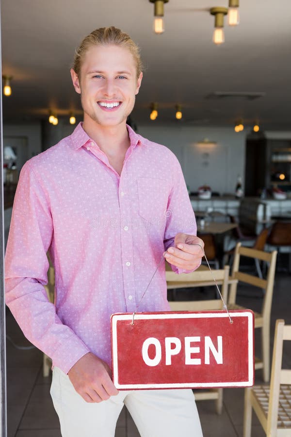 Restaurant Manager Holding Open Signboard Stock Image - Image of ...