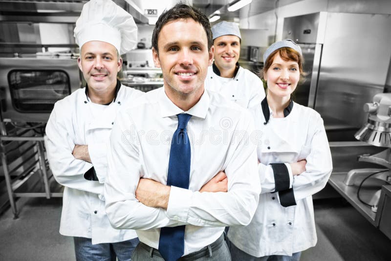 Restaurant Manager Posing in Front of Team of Chefs Stock Image - Image ...