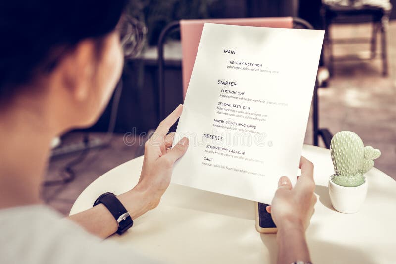 Close Up of a Menu Being in Female Hands Stock Photo - Image of ...