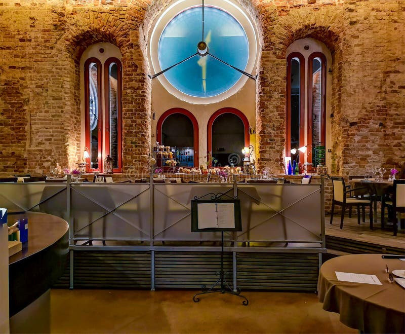 Restaurant in Old Tower with Clock Stock Photo - Image of menu, tables ...