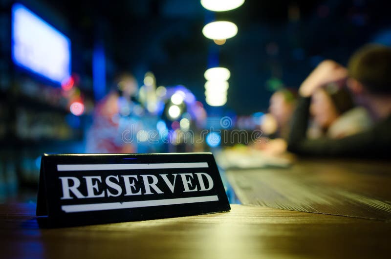 Restaurant Reserved Table Sign Standing on Wooden Table in Bar Stock ...