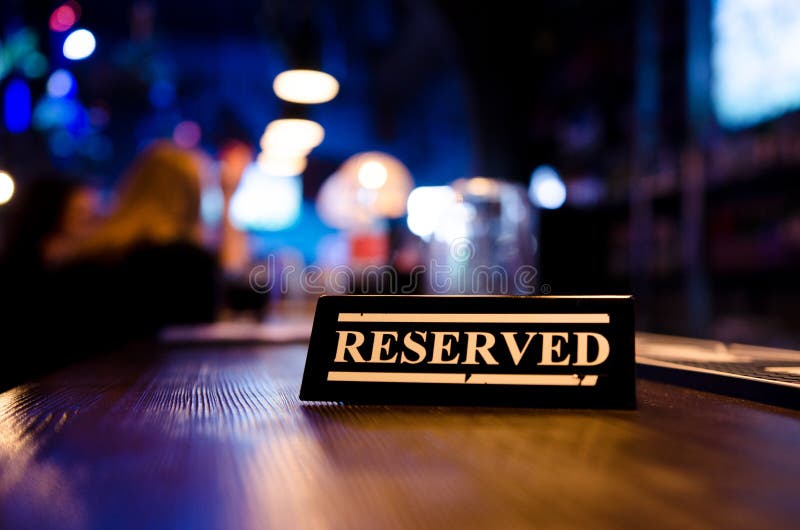 Restaurant Reserved Table Sign Standing on Wooden Table in Bar Stock ...