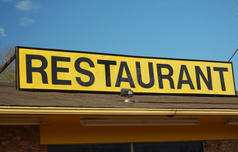 Restaurant Sign Outdoors on Building Roof with Blue Sky Stock Image ...