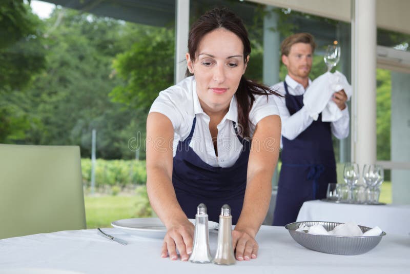 Preparing Tables in Cafe stock image. Image of bipoc - 234709395