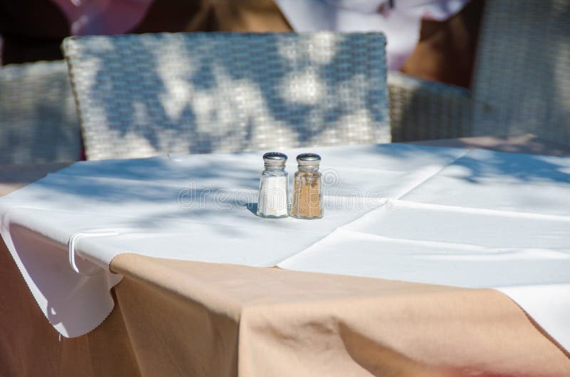 Restaurant Table with Salt and Pepper Stock Image - Image of salt ...