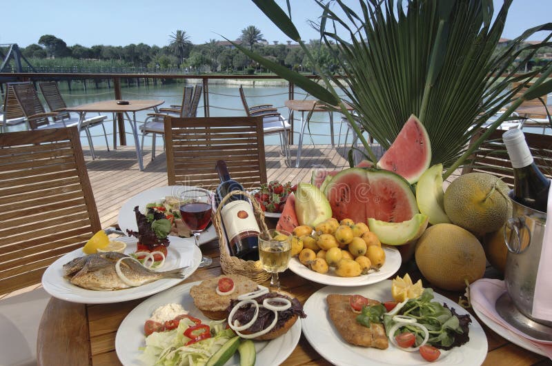 Restaurant Table with a Variety of Food on the Beach. Stock Image ...