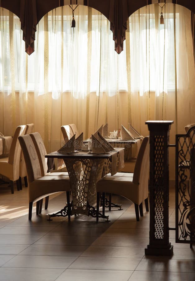 Restaurant Tables Near the Bright Window Stock Photo - Image of drink ...