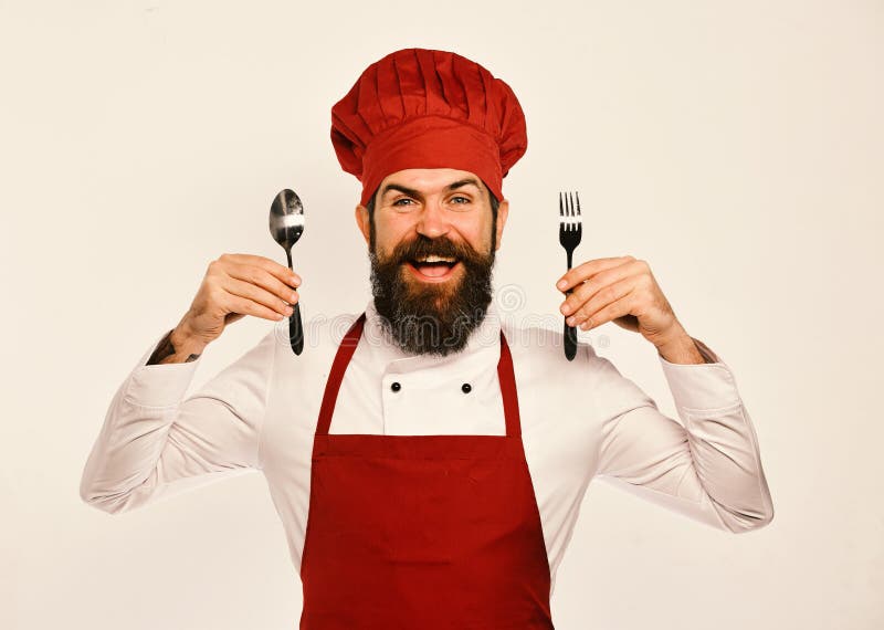 Restaurant Utensils Concept. Man with Beard Holds Fork and Spoon Stock ...