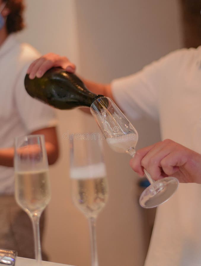 Restaurant Waiter Serving Champagne Stock Image - Image of holding ...