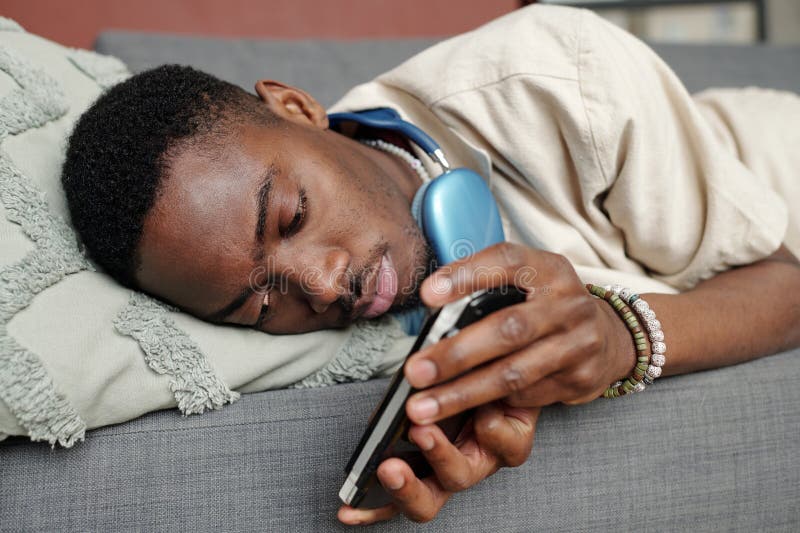 Restful Guy Playing Video Game on Couch Stock Image - Image of ...