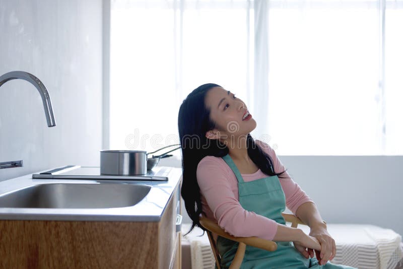 Resting on a Chair in the Kitchen Stock Image - Image of resting ...