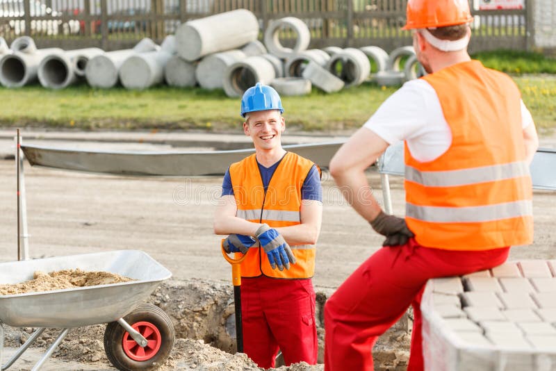 Resting Construction Workers Stock Photo - Image of road, pavement ...